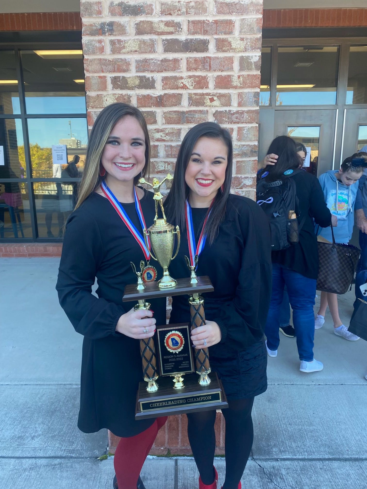 Meet Maddie Benton, head varsity competition cheer coach at Cherokee ...